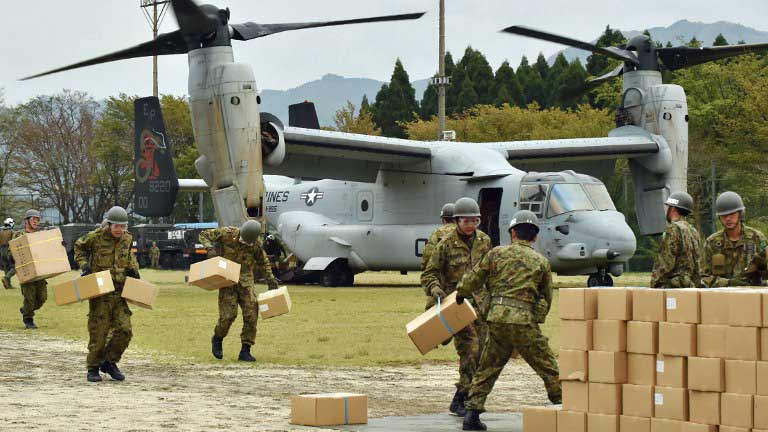 Japan battles to care for 100,000 evacuees after earthquake